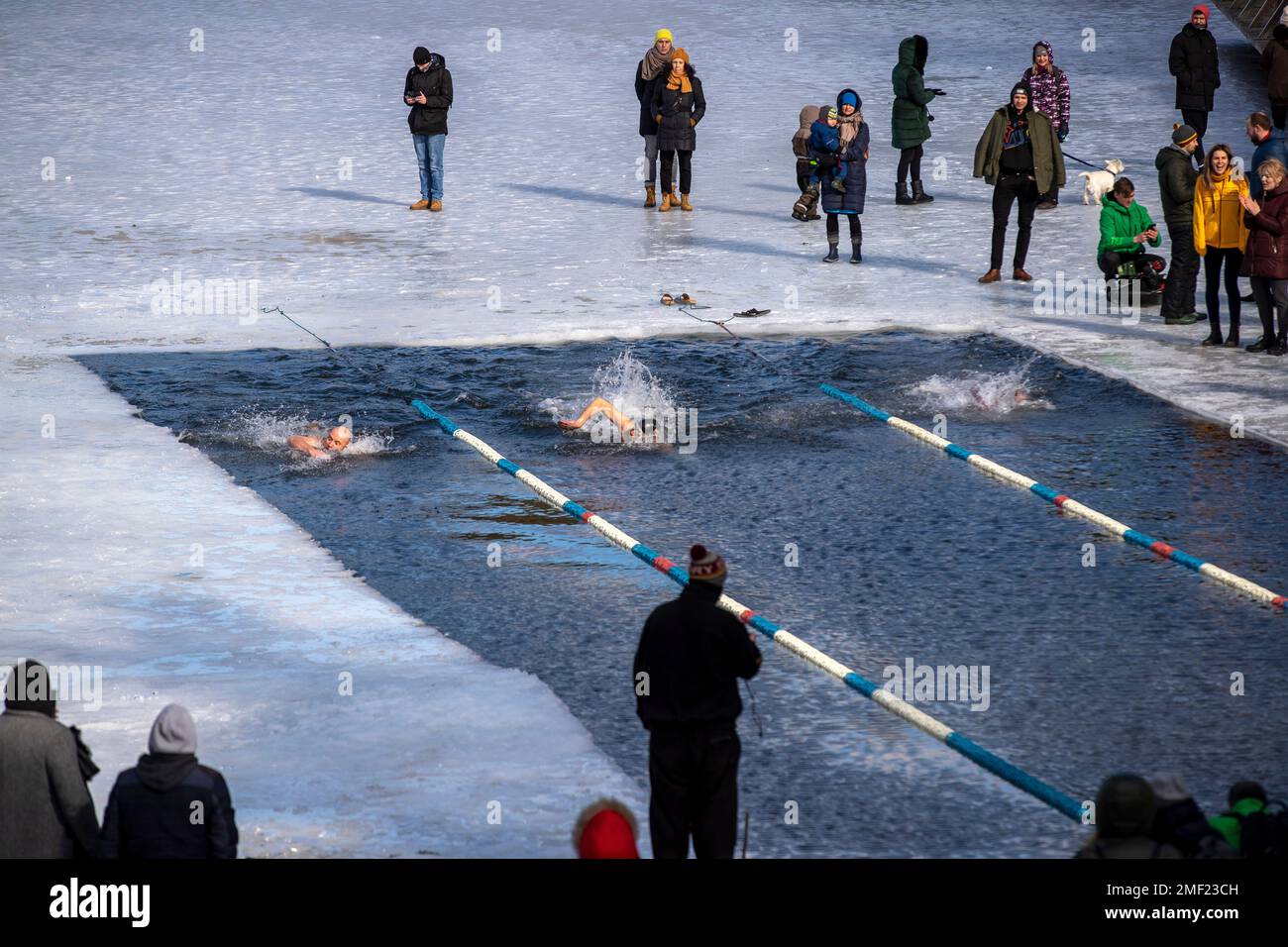 Swimmers compete during a winter swimming competition in the 25 meters ...