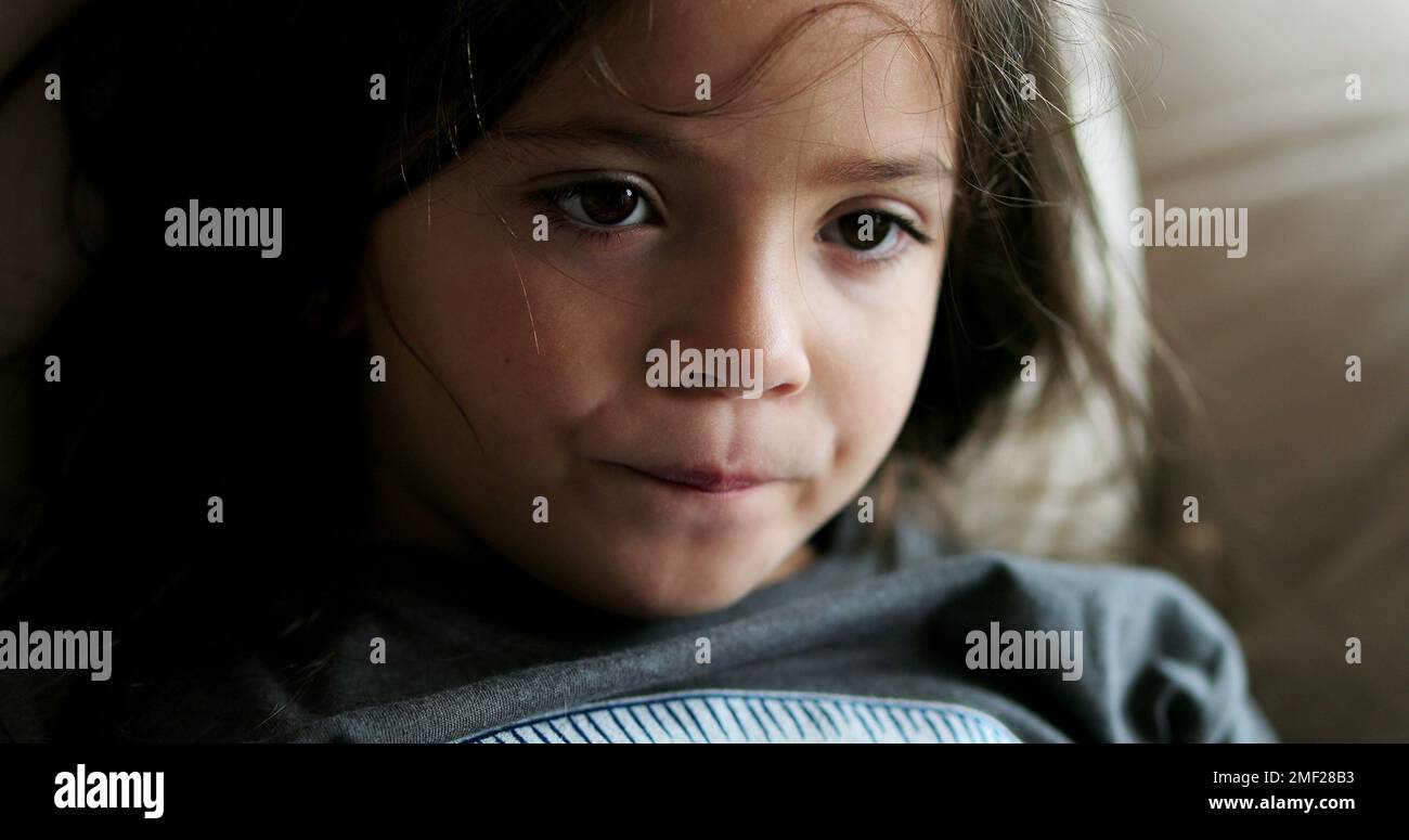 Closeup child girl face staring off camera portrait Stock Photo - Alamy