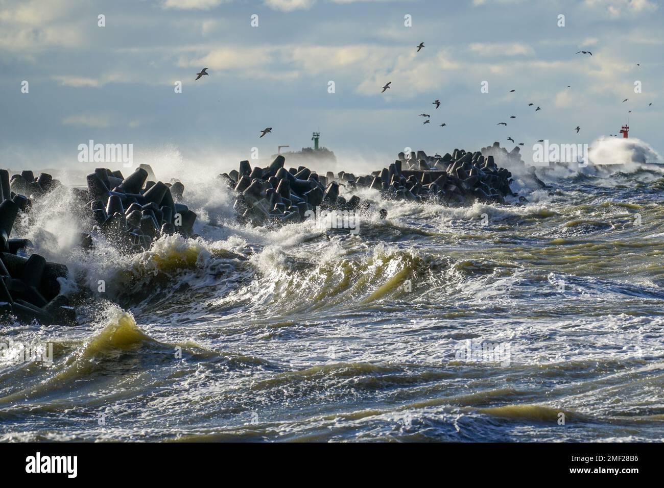 Coastal storm in the Baltic Sea, big waves crash against the concrete ...