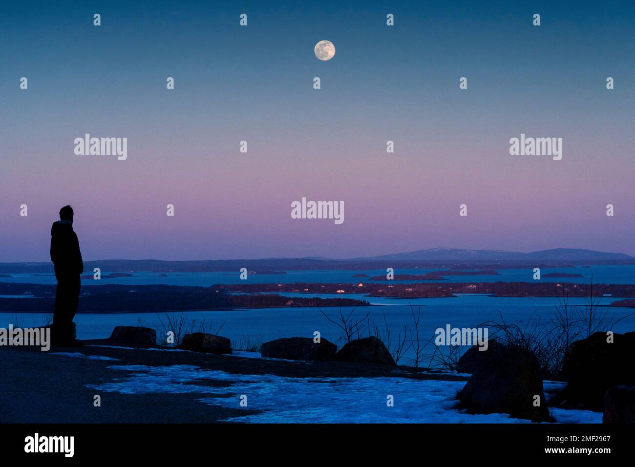 Shawn Griffith, of South Port, Maine, watches the nearly-full "snow ...