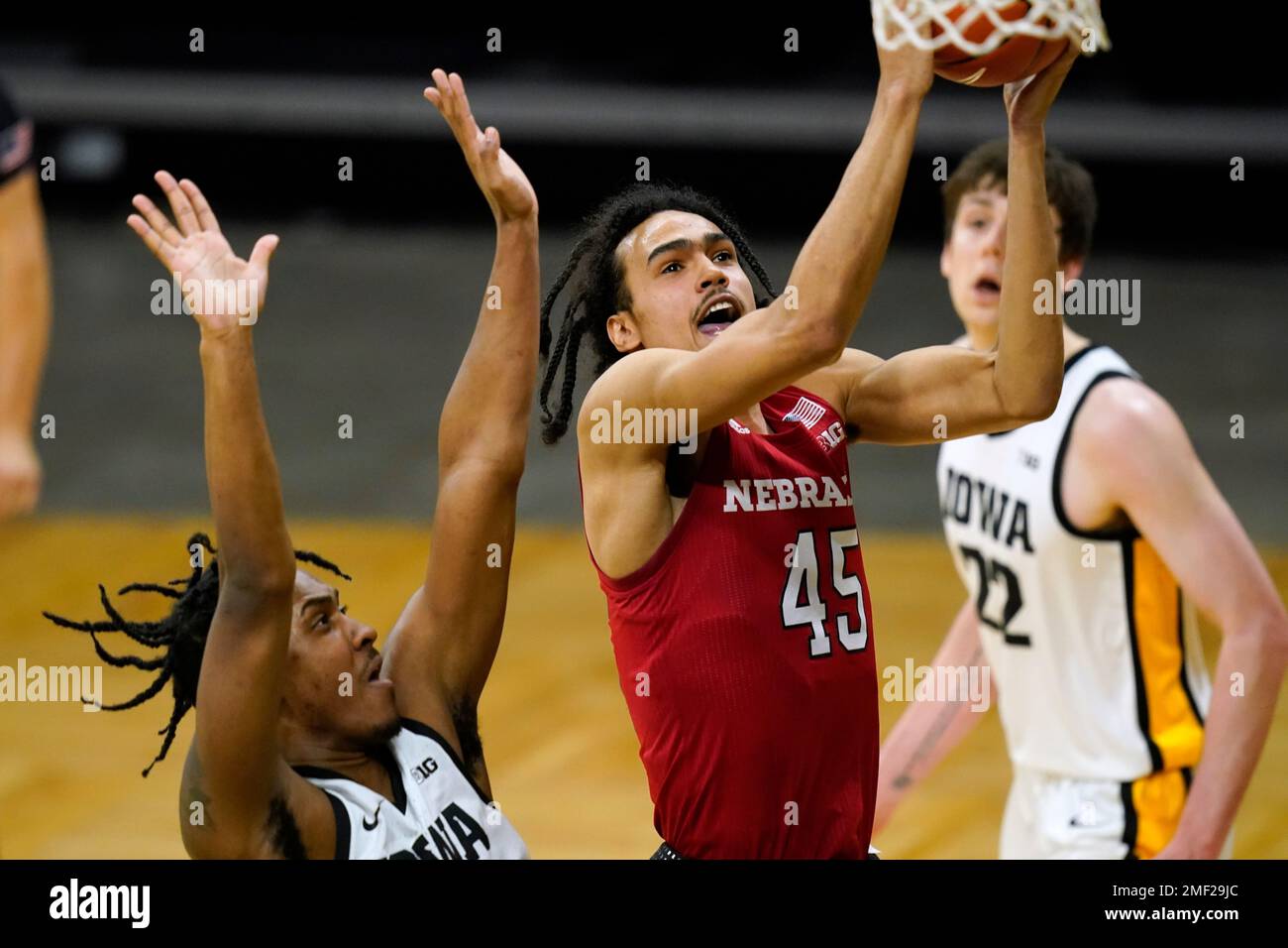 Nebraska guard Dalano Banton (45) drives to the basket ahead of Iowa ...