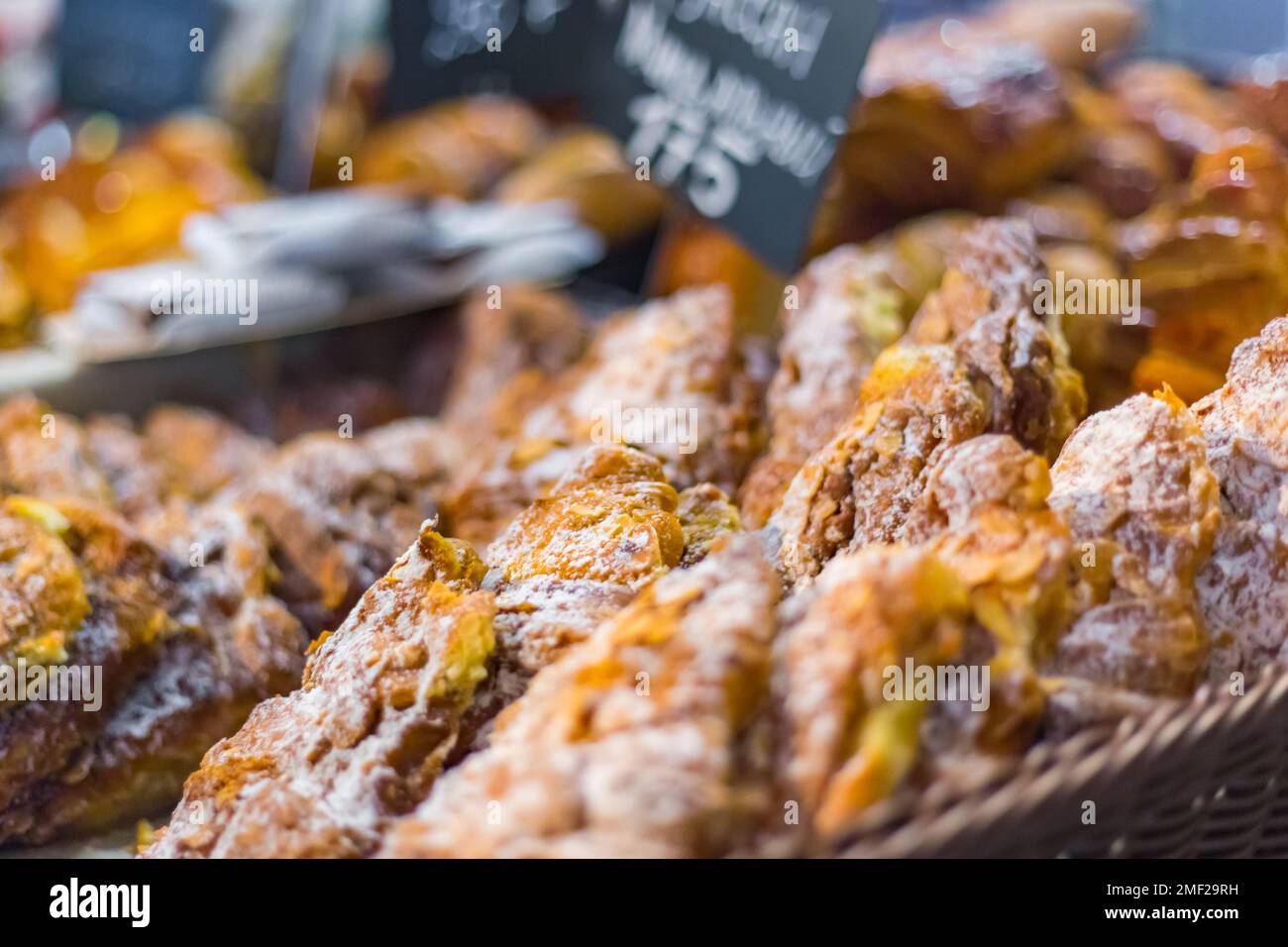Assortment of freshly baked pastry for sale on counter of french bakery ...