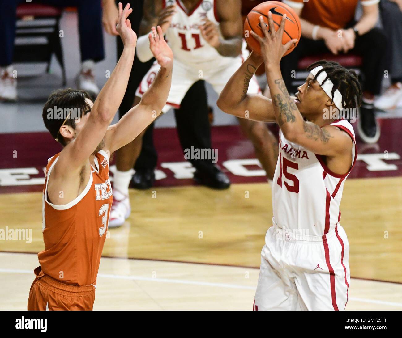Oklahoma guard Alondes Williams (15) shoots the ball over Texas forward ...