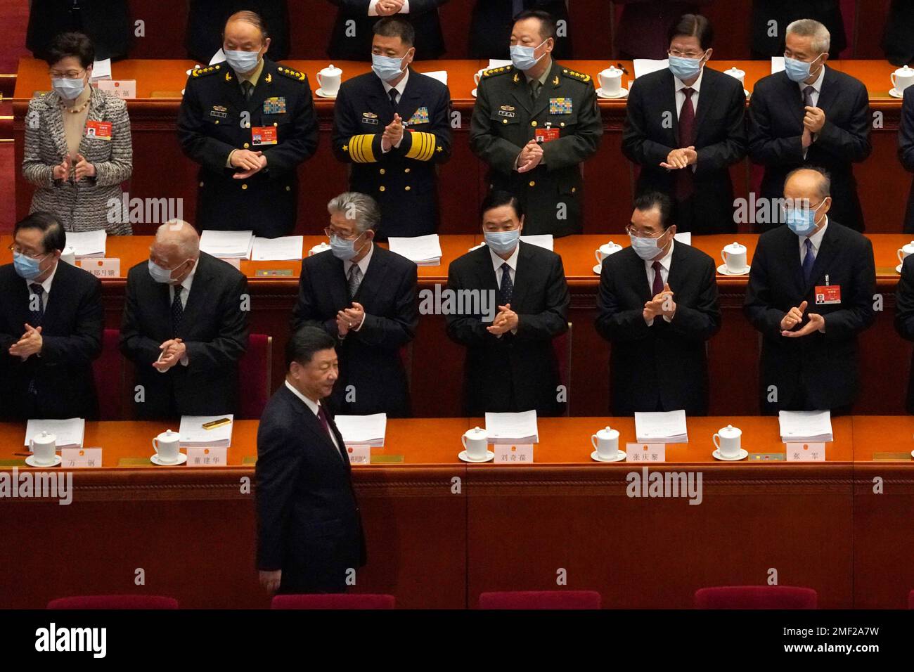 Delegates applaud as Chinese President Xi Jinping arrives for the ...