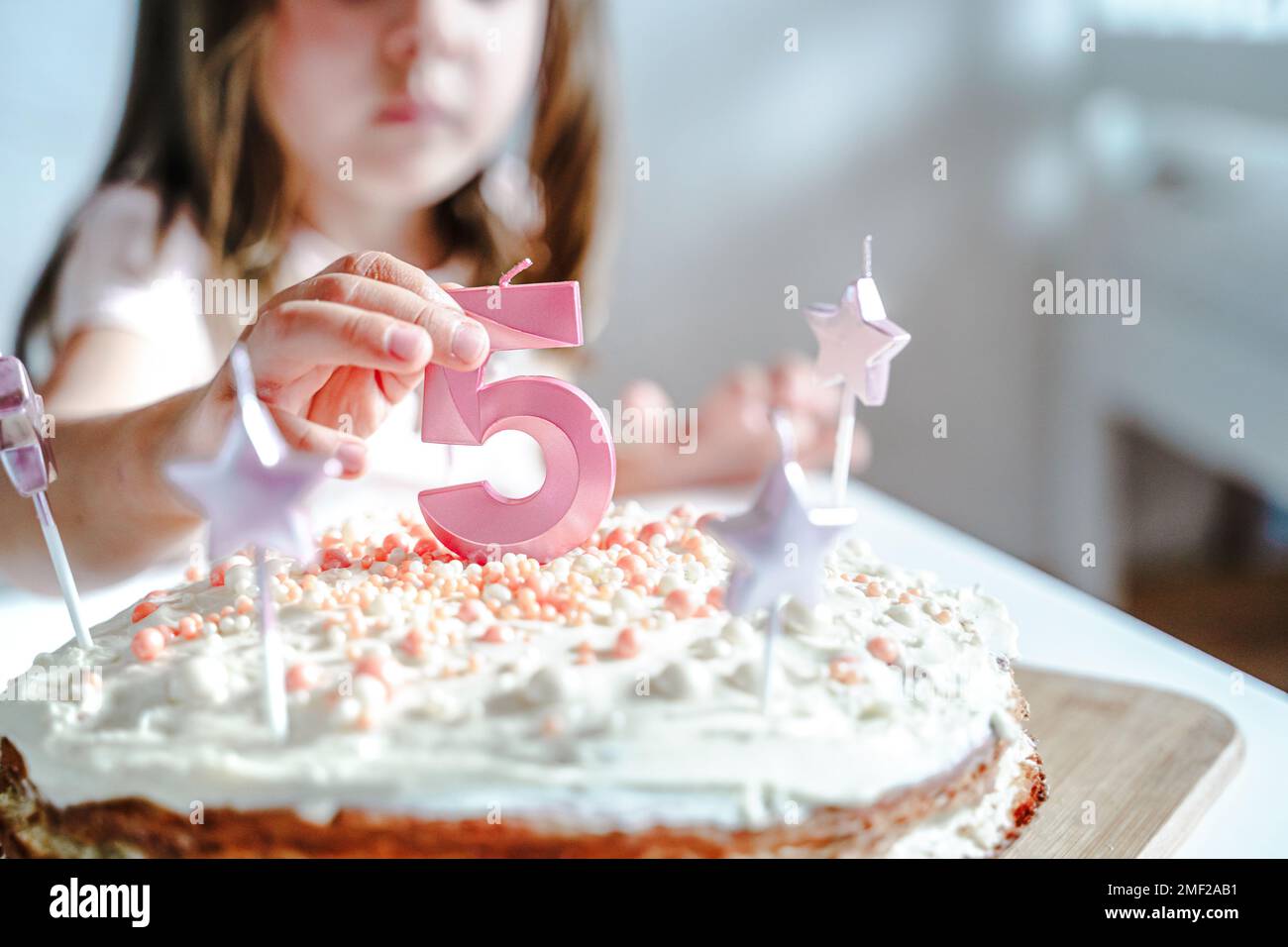 Big pink 5 number candle on homemade cake. Creative congratulations on ...