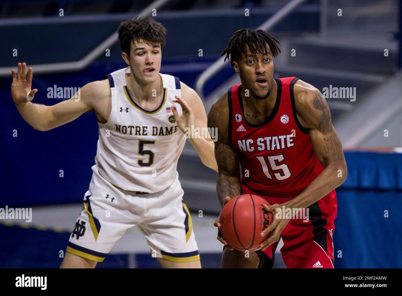 North Carolina State's Manny Bates (15) looks to pass next to Notre ...