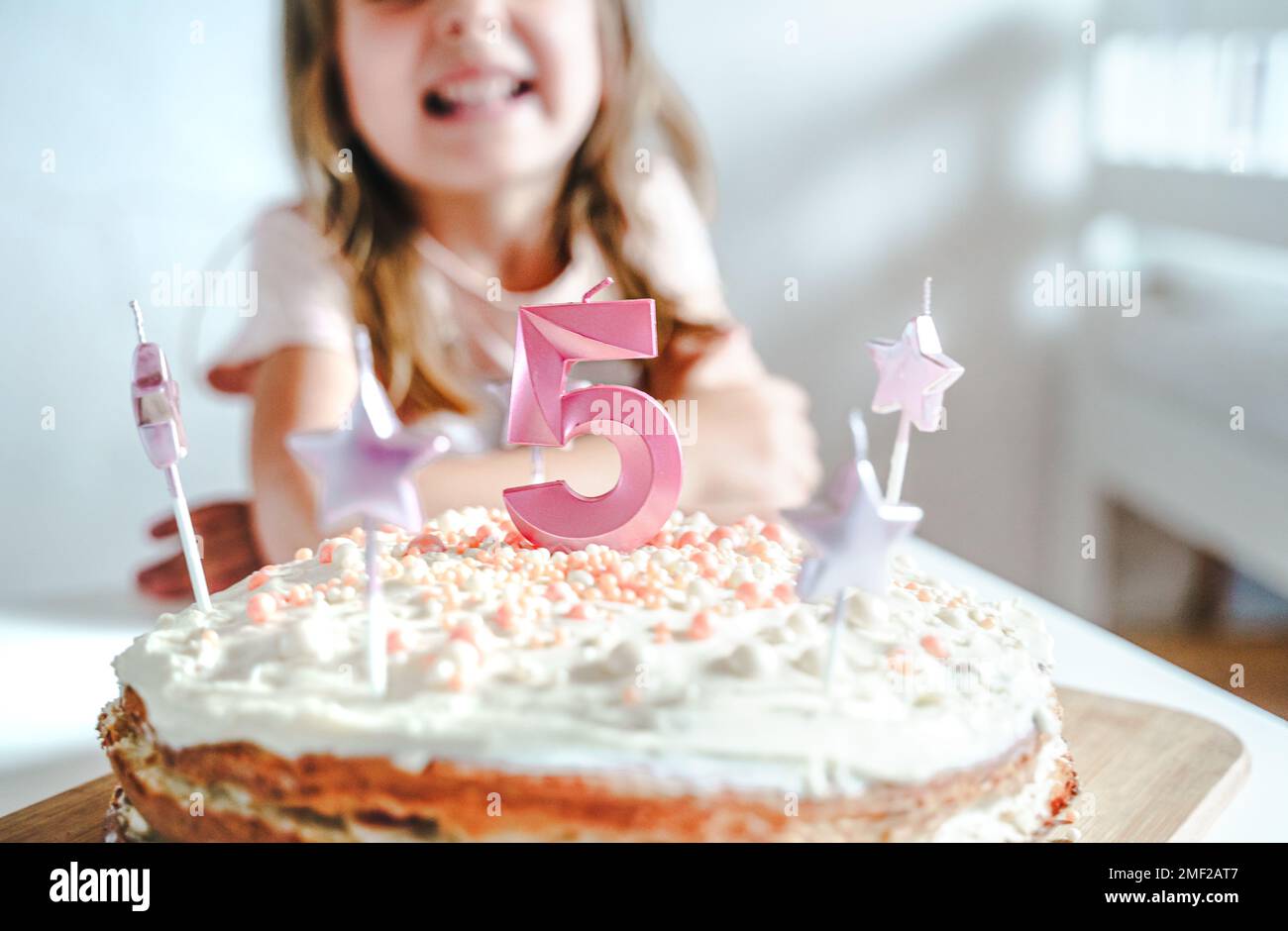 Big pink 5 number candle on homemade cake. Creative congratulations on ...