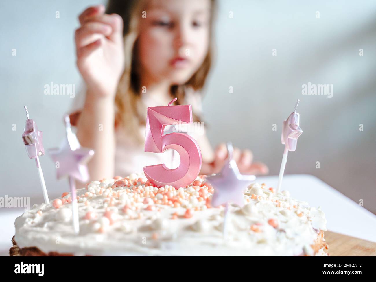 Big pink 5 number candle on homemade cake. Creative congratulations on ...