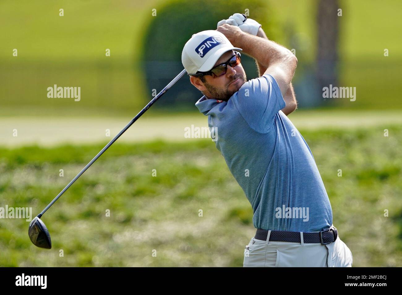 Corey Conners, of Canada, tees off on the 18th hole during the first ...