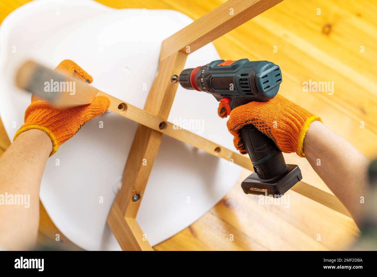 Assemble furniture. Man assembling chair. Furniture assembler with ...