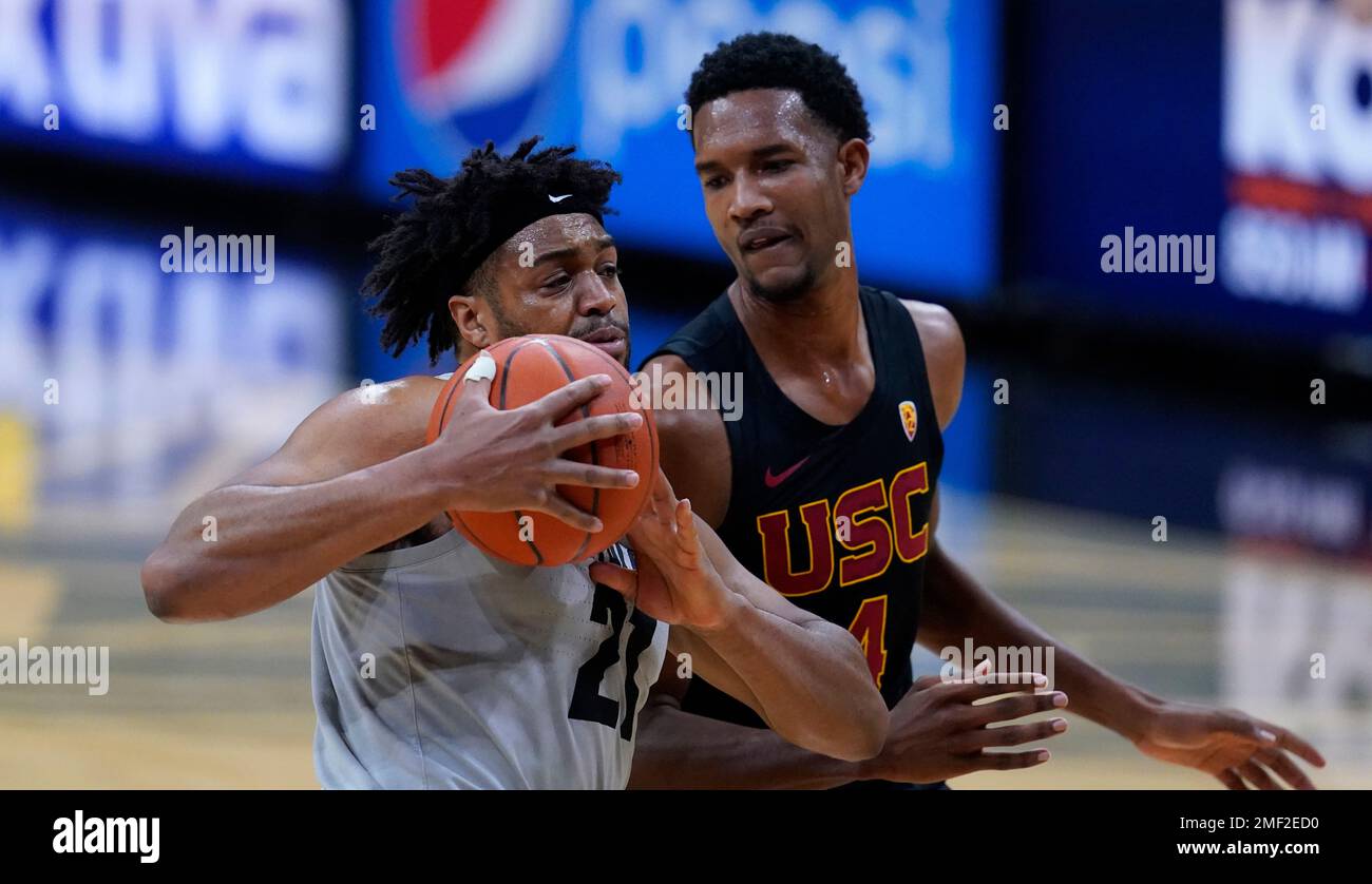 Colorado forward Evan Battey (21) and USC forward Evan Mobley (4) in ...
