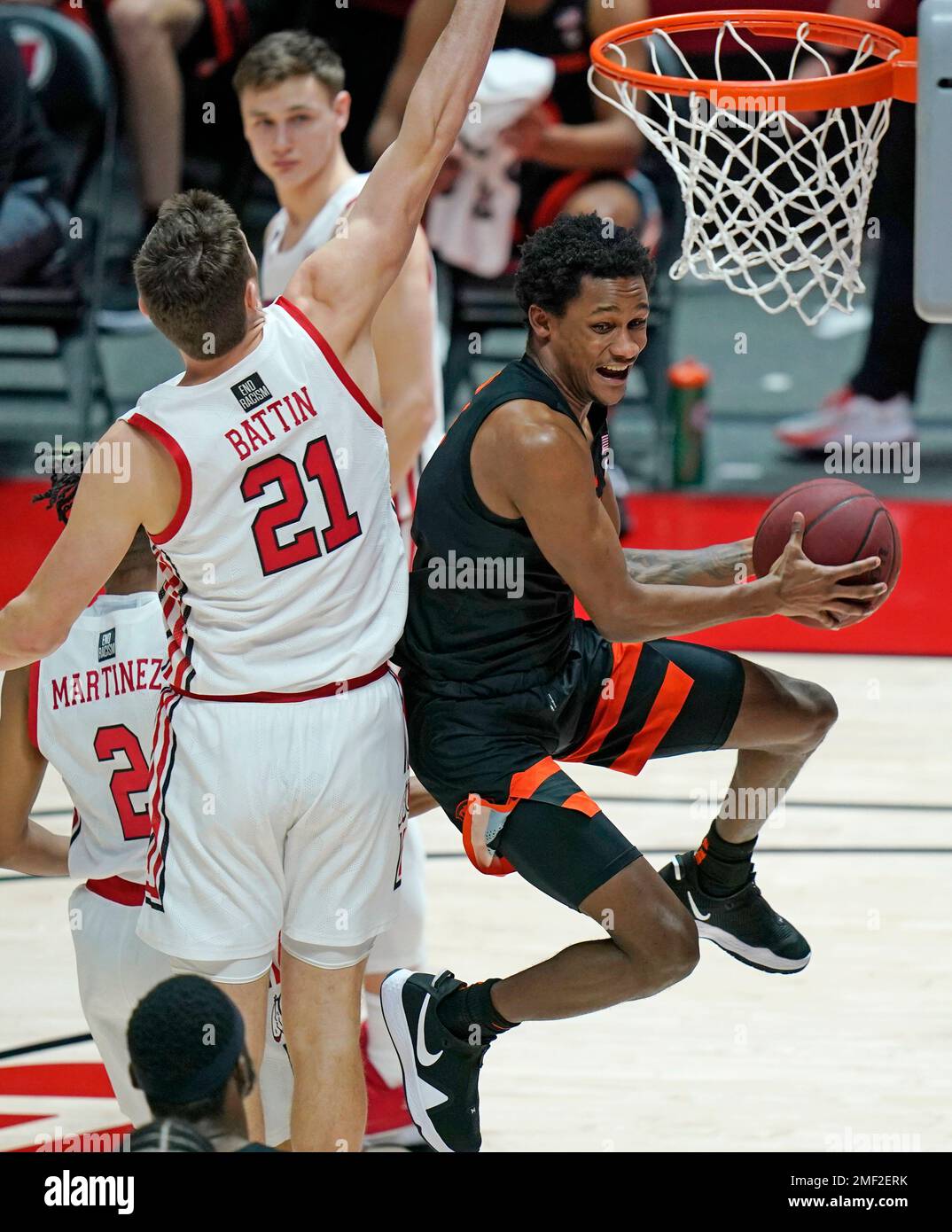 Oregon State guard Gianni Hunt, right, goes to the basket as Utah ...