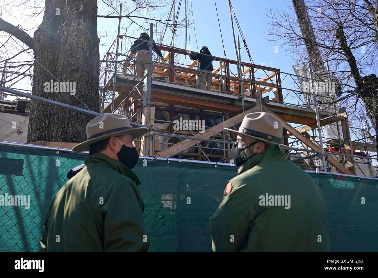 Massachusetts park rangers watch as the restored bronze relief of the ...