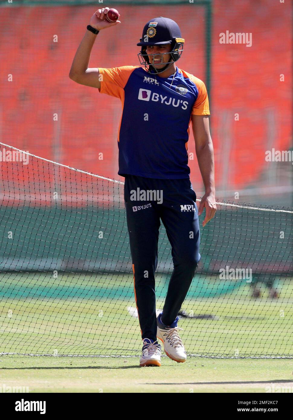 India's Shubman Gill holds a ball as he participates in a training ...