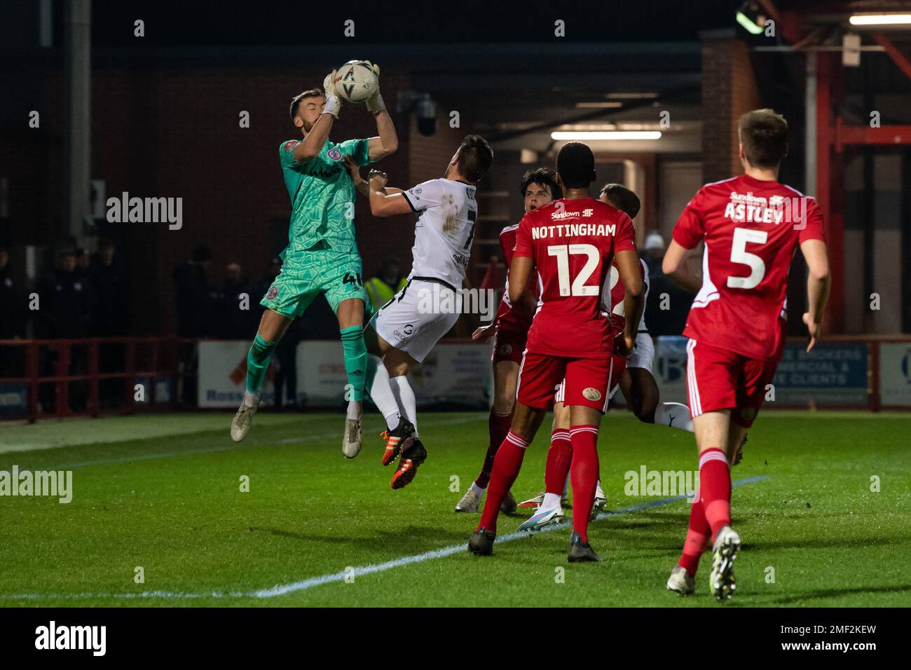 Toby Savin #40 of Accrington Stanley claims the cross ahead of Josh ...