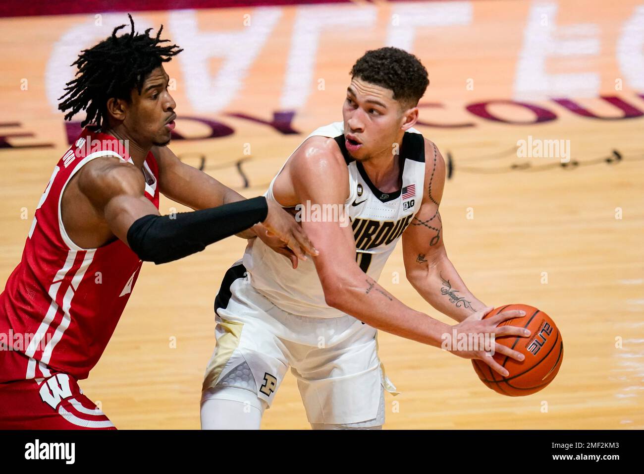 Wisconsin forward Aleem Ford (2) defends Purdue forward Mason Gillis (0 ...