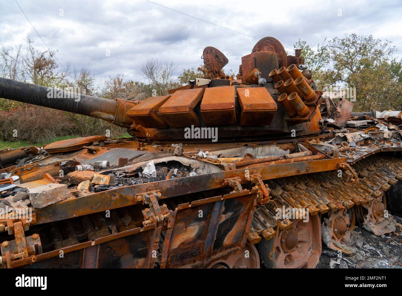 Countryside after the battle. A destroyed burned-out battle tank stands ...
