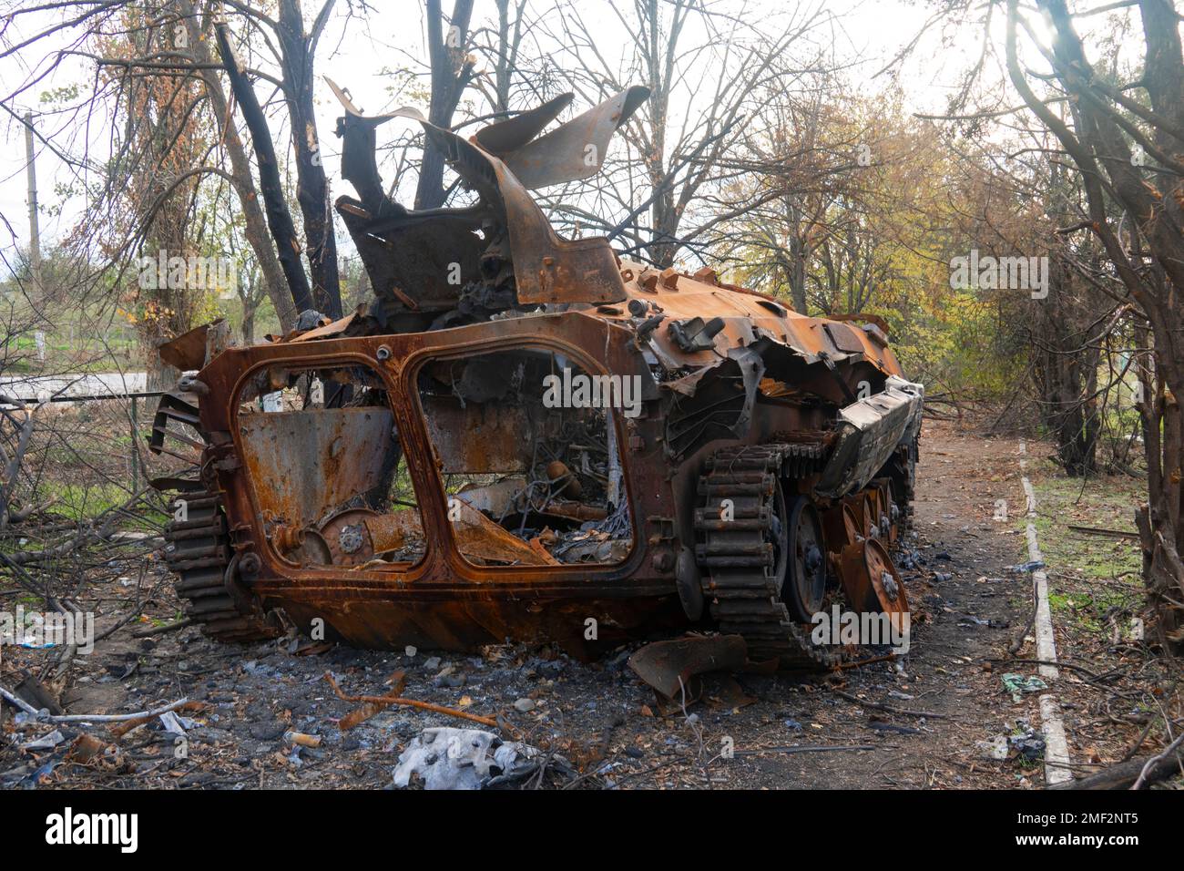 Countryside after the battle. A destroyed, burned-out combat vehicle ...