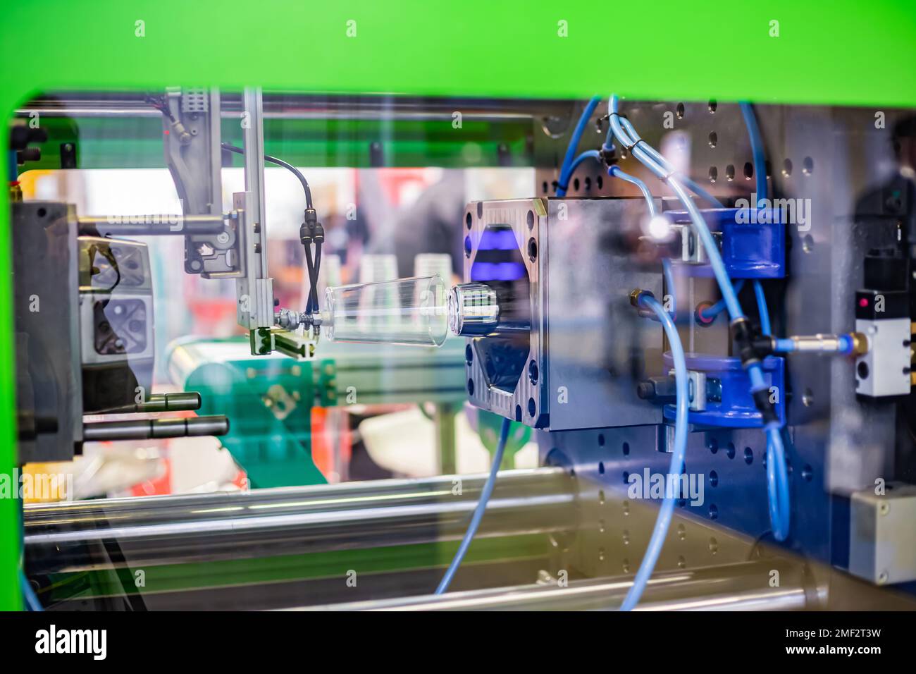 Automatic injection molding machine making plastic cup Stock Photo - Alamy