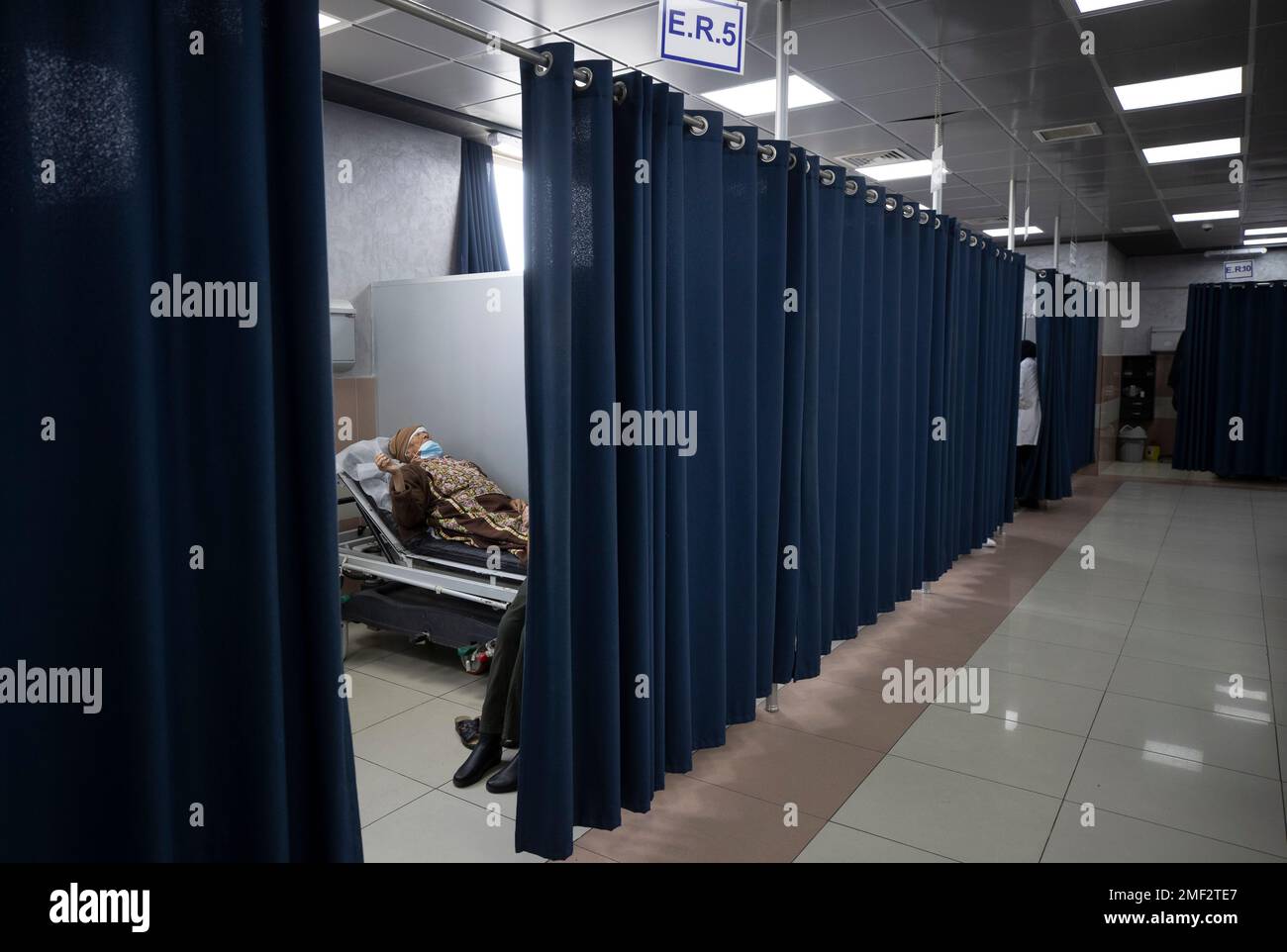A Palestinian patient infected with COVID-19 is placed under medical ...