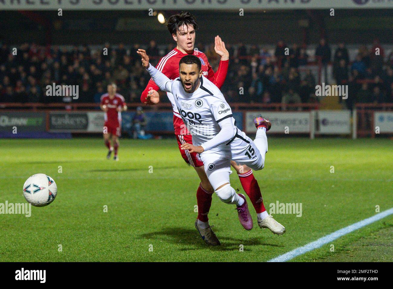 Dennon Lewis #15 of Boreham Wood is fouled by Doug Tharme #34 of ...