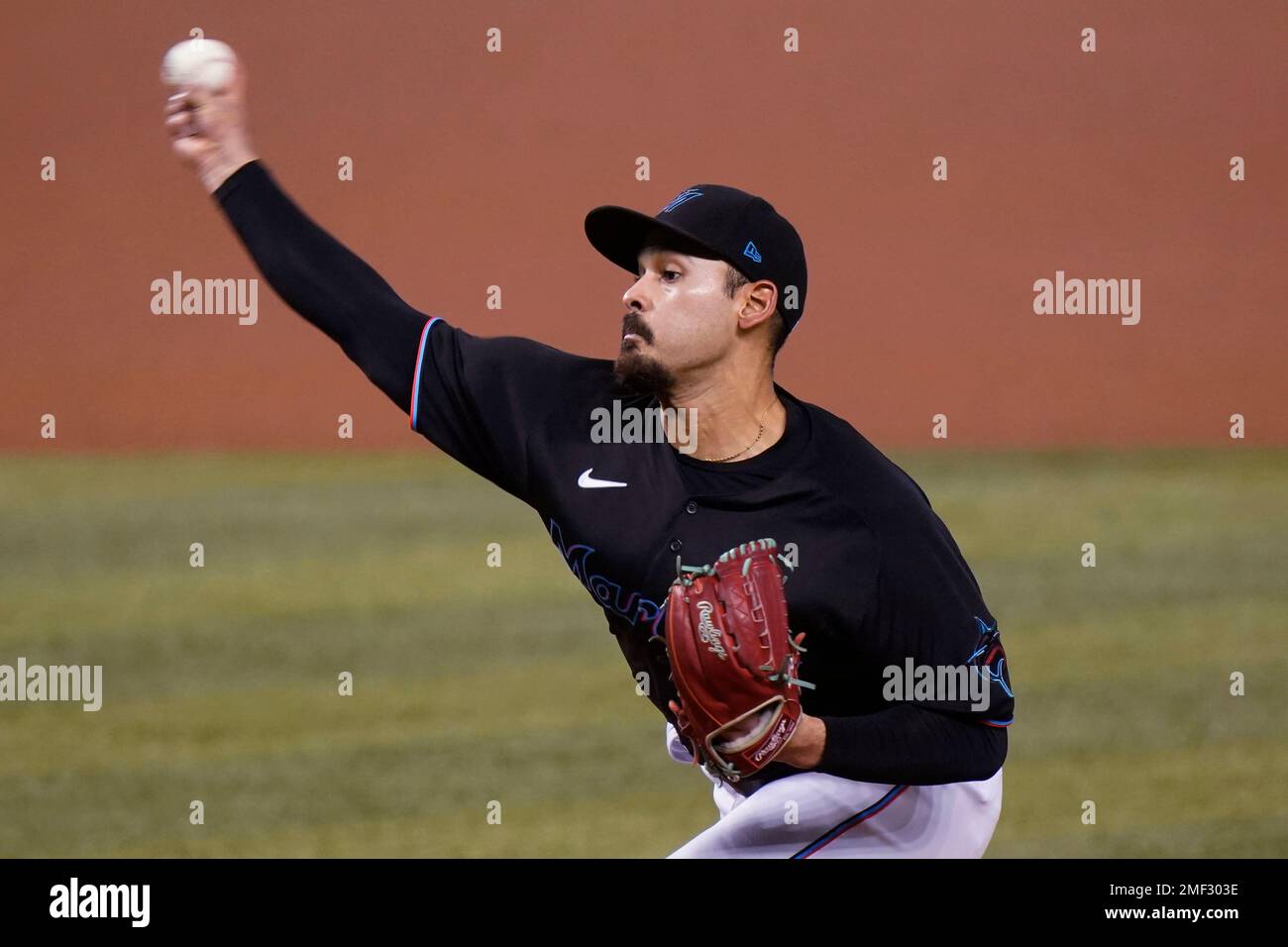 FILE - Miami Marlins starting pitcher Pablo Lopez throws during the ...