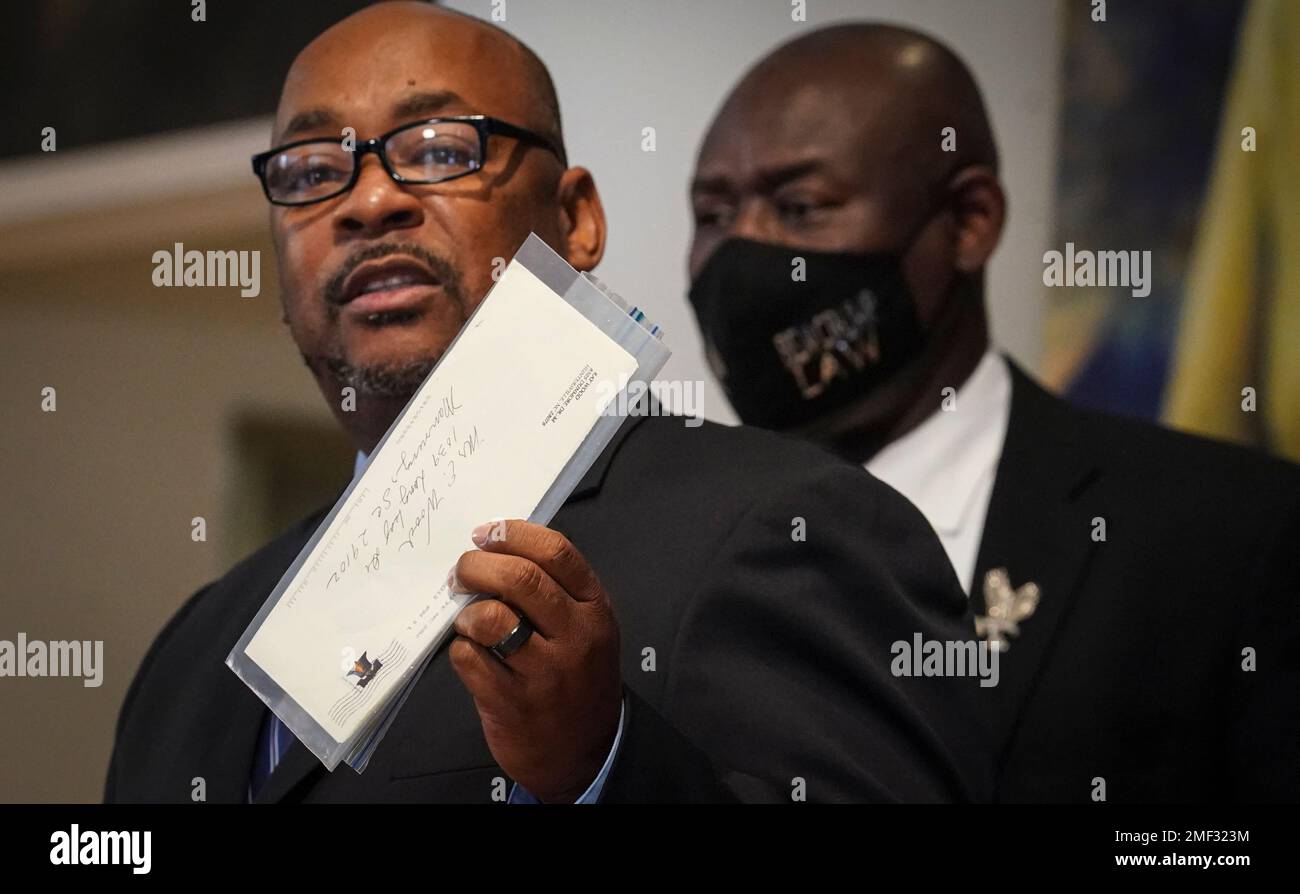Reggie Wood, left, stands with civil rights lawyer Ben Crump, while ...