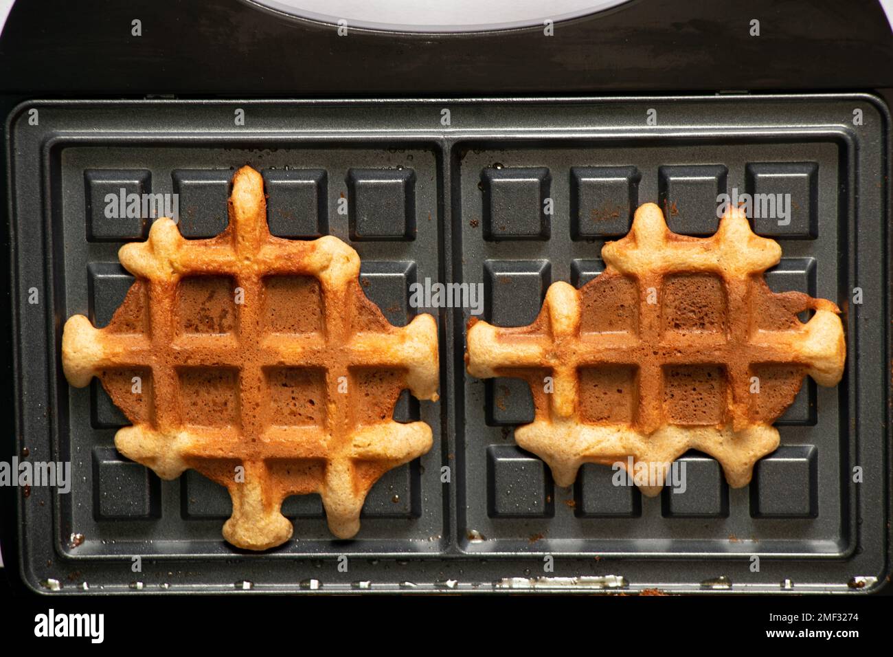 vienna waffle and waffle iron on isolated background for backgrounds ...