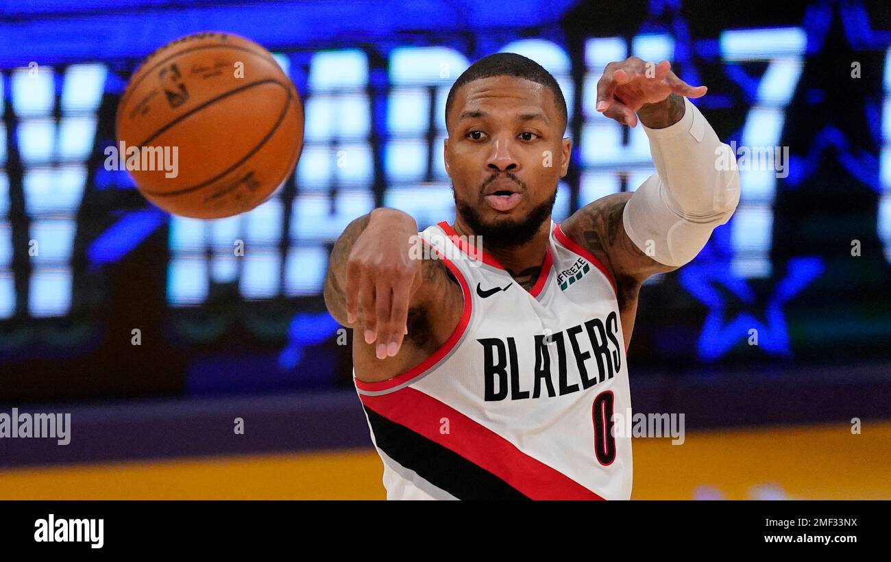 Portland Trail Blazers guard Damian Lillard passes the ball during the second half of an NBA ...