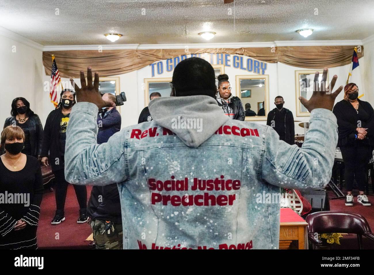 The Rev. Kevin McCall leads a prayer before a recording session for an ...