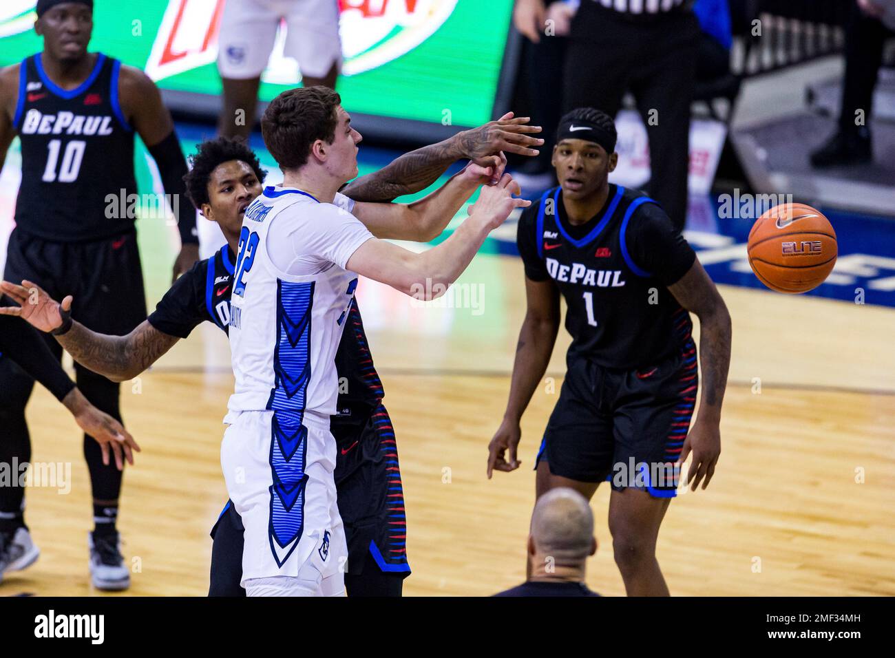 DePaul forward Darious Hall (13) knocks the ball away from Creighton ...