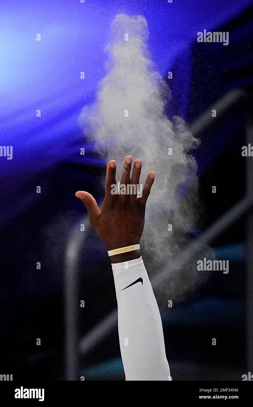 Los Angeles Lakers forward LeBron James tosses powder in the air prior ...