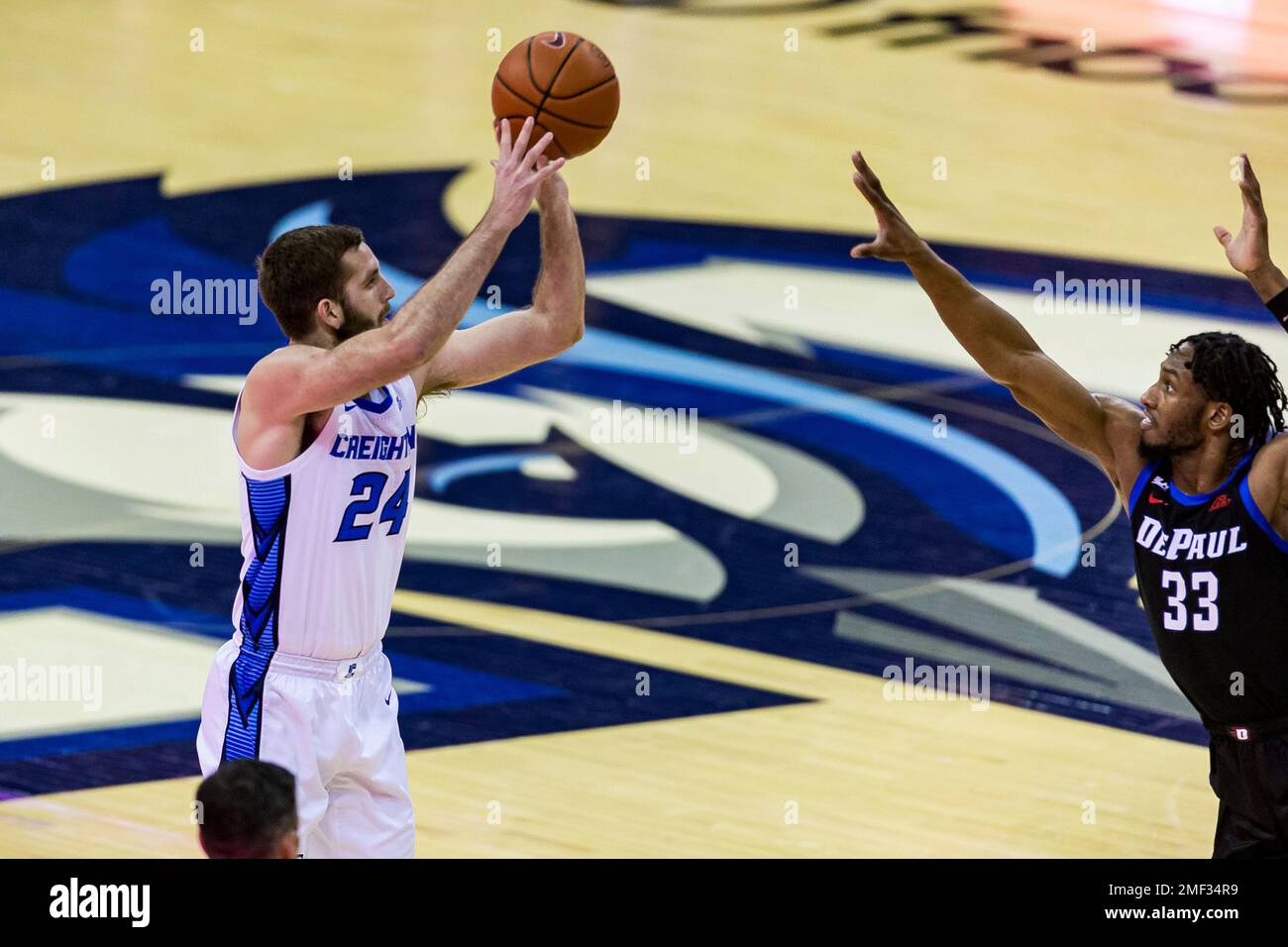 Creighton guard Mitch Ballock (24) shoots a three point shot over ...