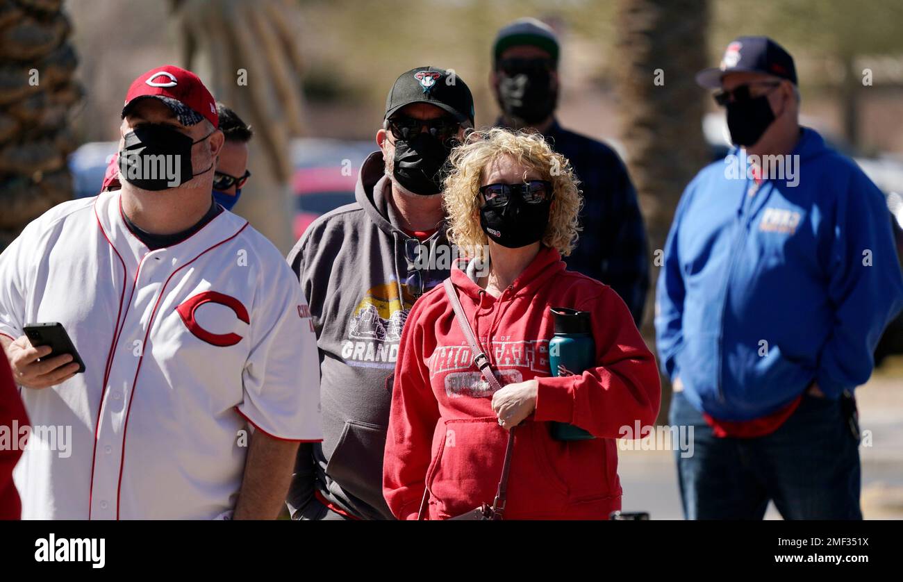 Baseball fans wait in line for the gates to open at Goodyear Ballpark ...