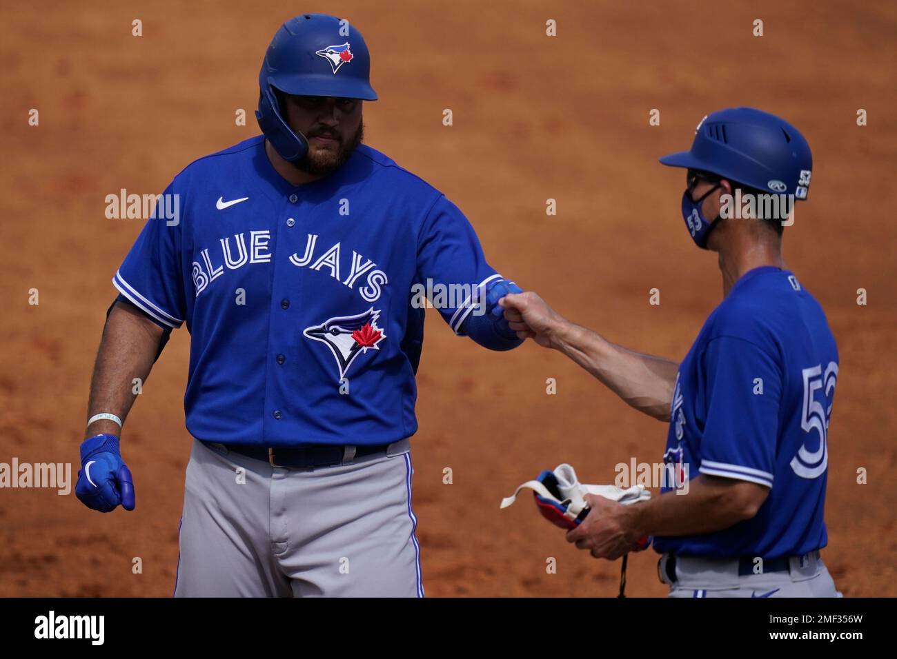 Toronto Blue Jays' Rowdy Tellez, left, celebrates a single with first ...