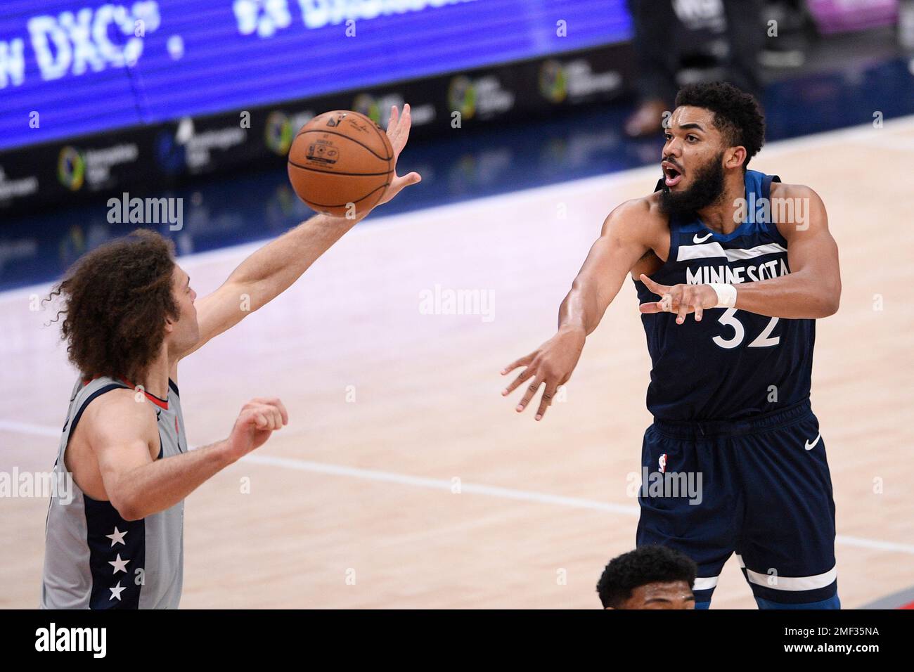 Minnesota Timberwolves center Karl-Anthony Towns (32) passes the ball ...