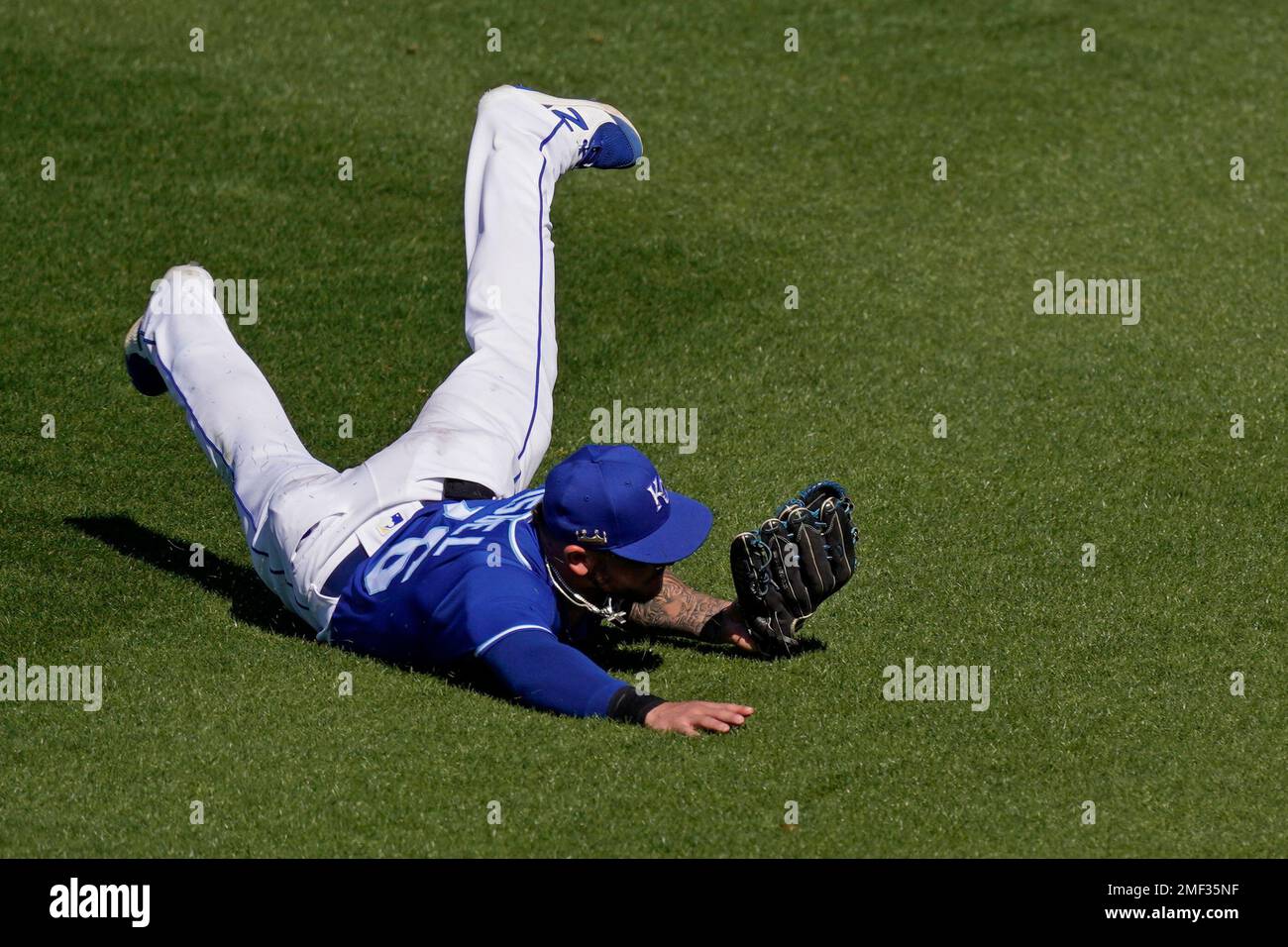 Kansas City Royals left fielder Kyle Isbel catches a fly ball for the ...