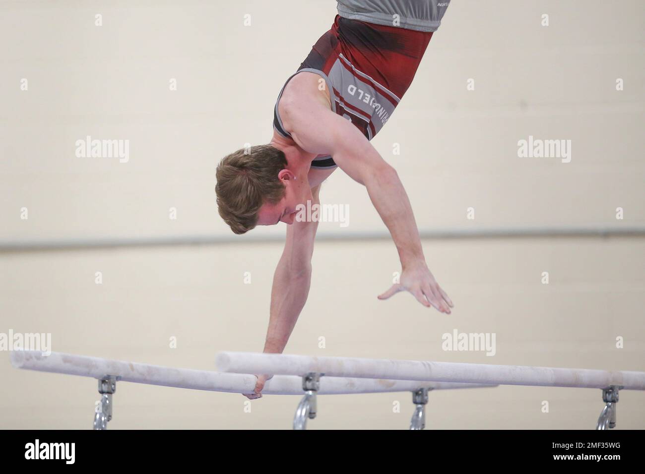 Springfield's Collin Maberry competes on the parallel bars during an ...