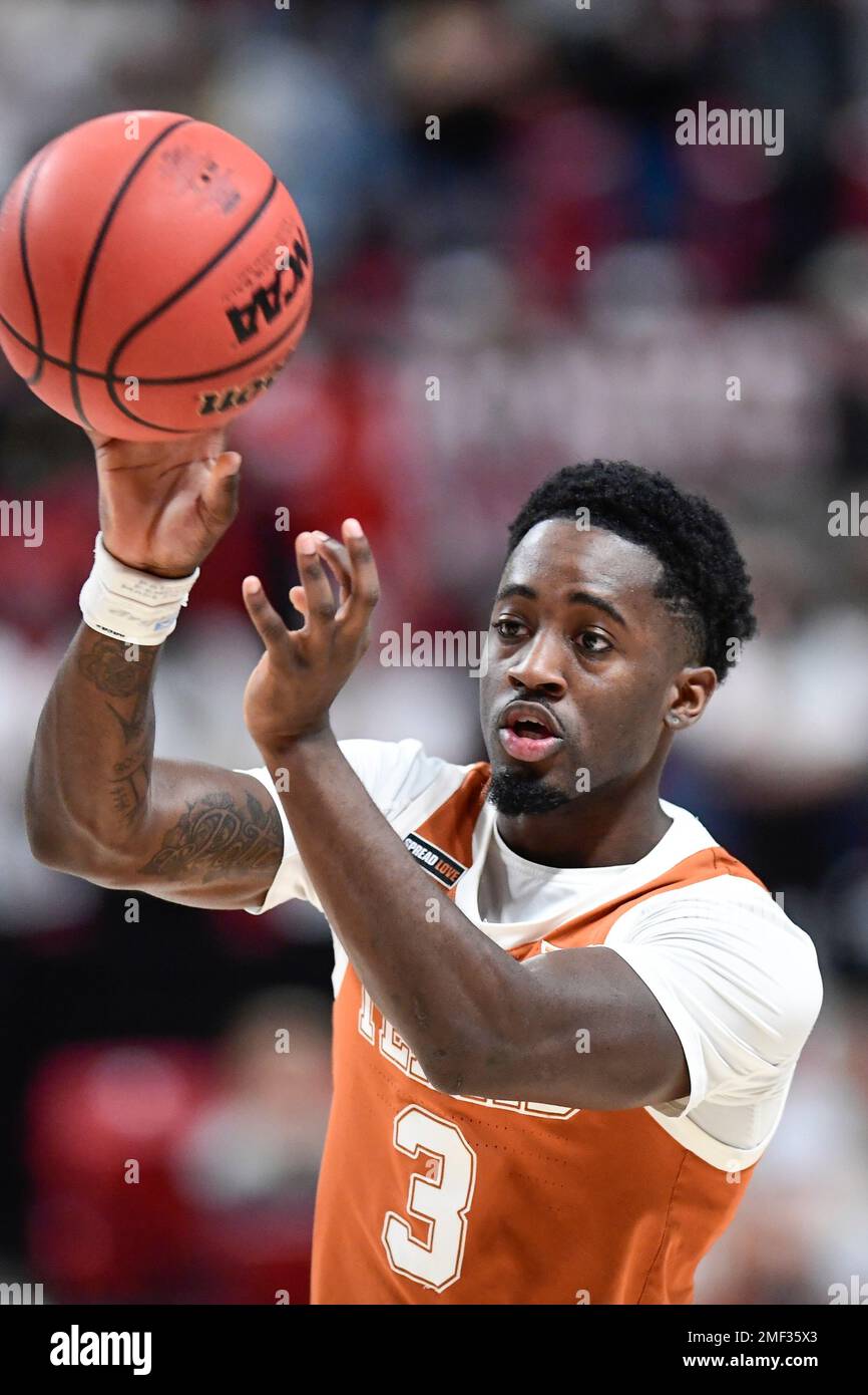 Texas' Courtney Ramey (3) passes the ball during the first half of an ...