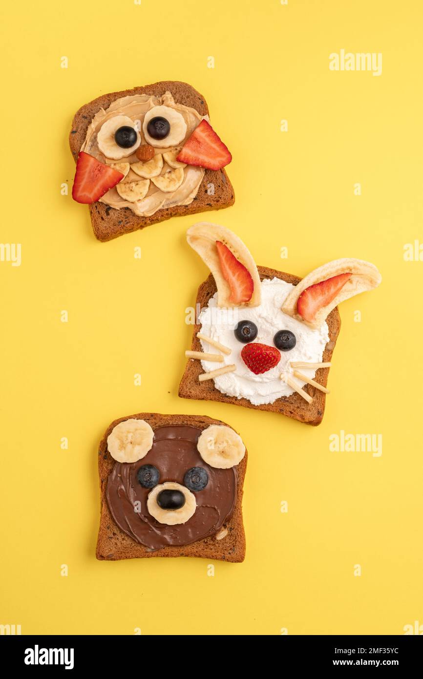 Funny animal faces toasts for kids lunch Stock Photo - Alamy