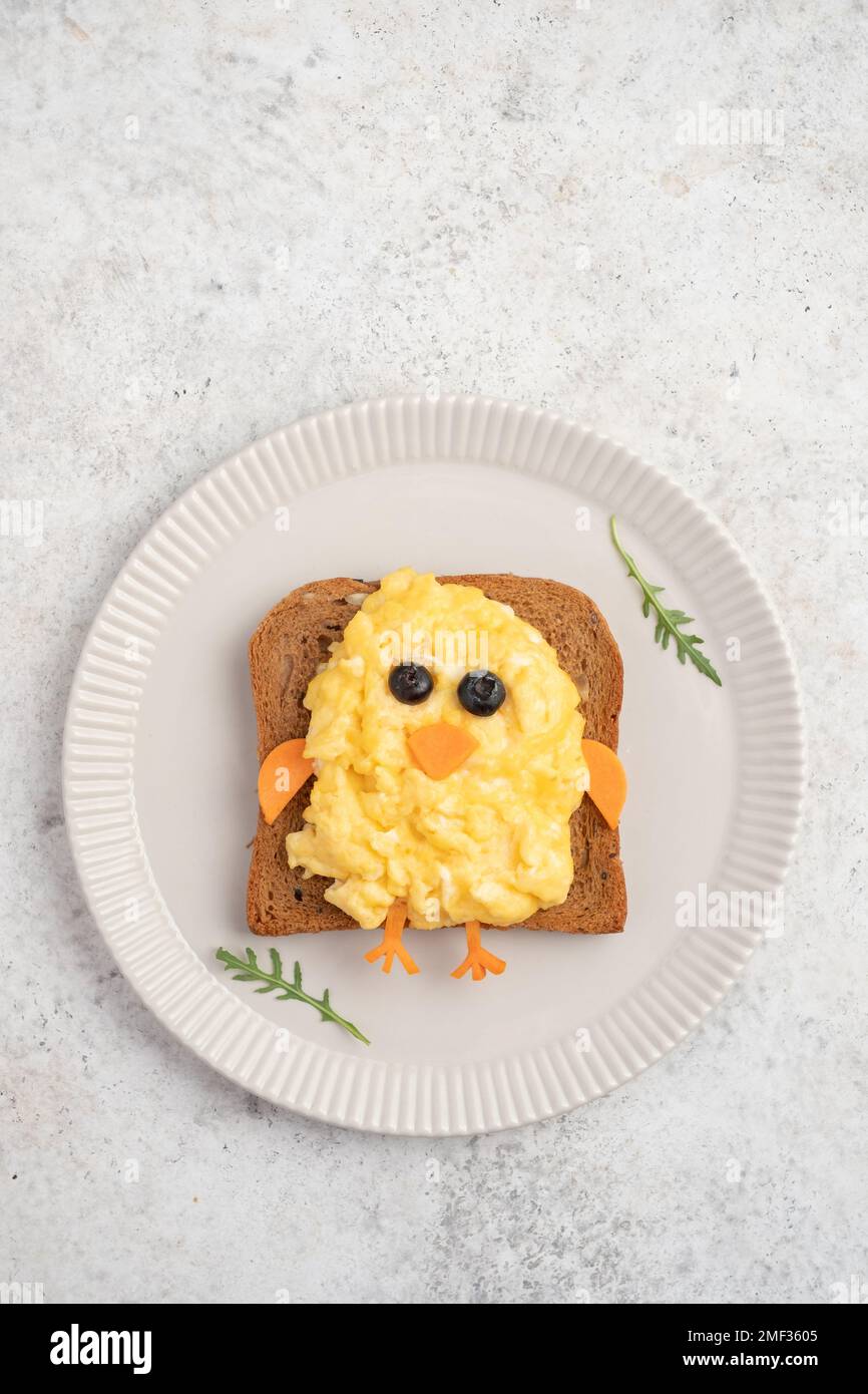 Funny toast with scrambled eggs in a shape of chicken Stock Photo - Alamy