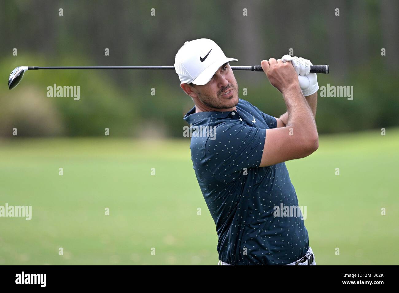 Brooks Koepka hits from the seventh fairway during the final round of ...