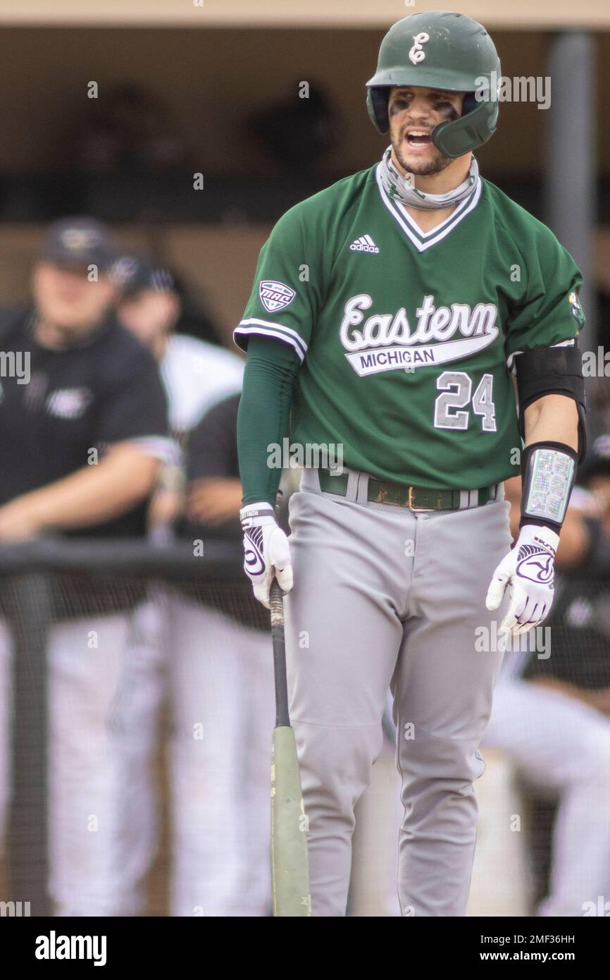Eastern Michigan catcher/infielder Gabe Denton (24) argues balls and ...