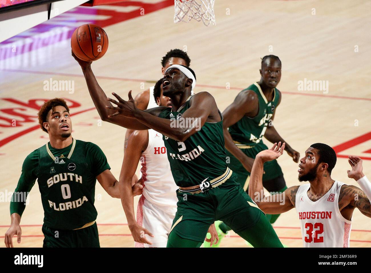 South Florida forward Prince Oduro, center, shoots during the first ...