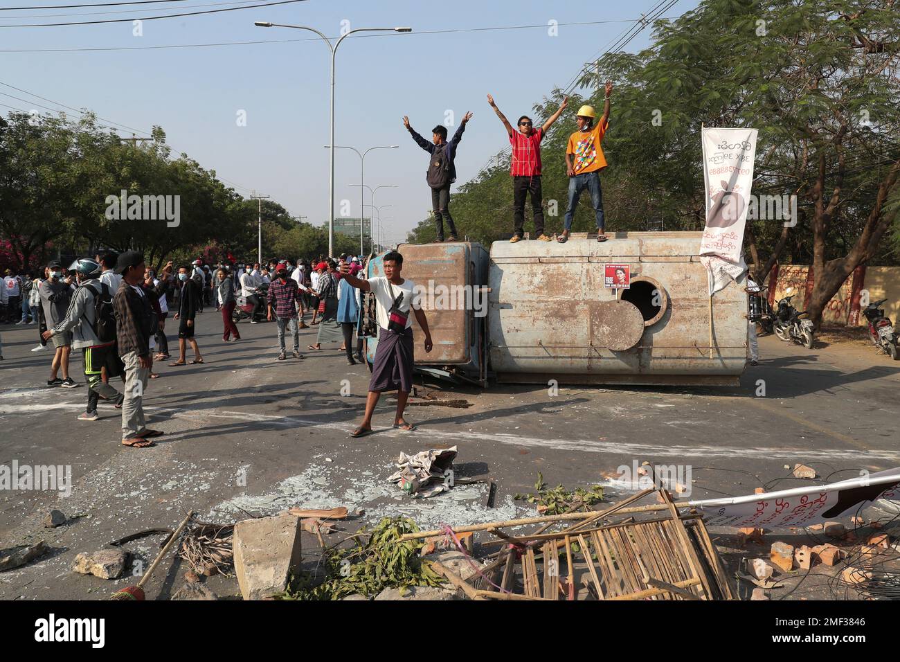 Protesters gesture to police during the protest against the military ...