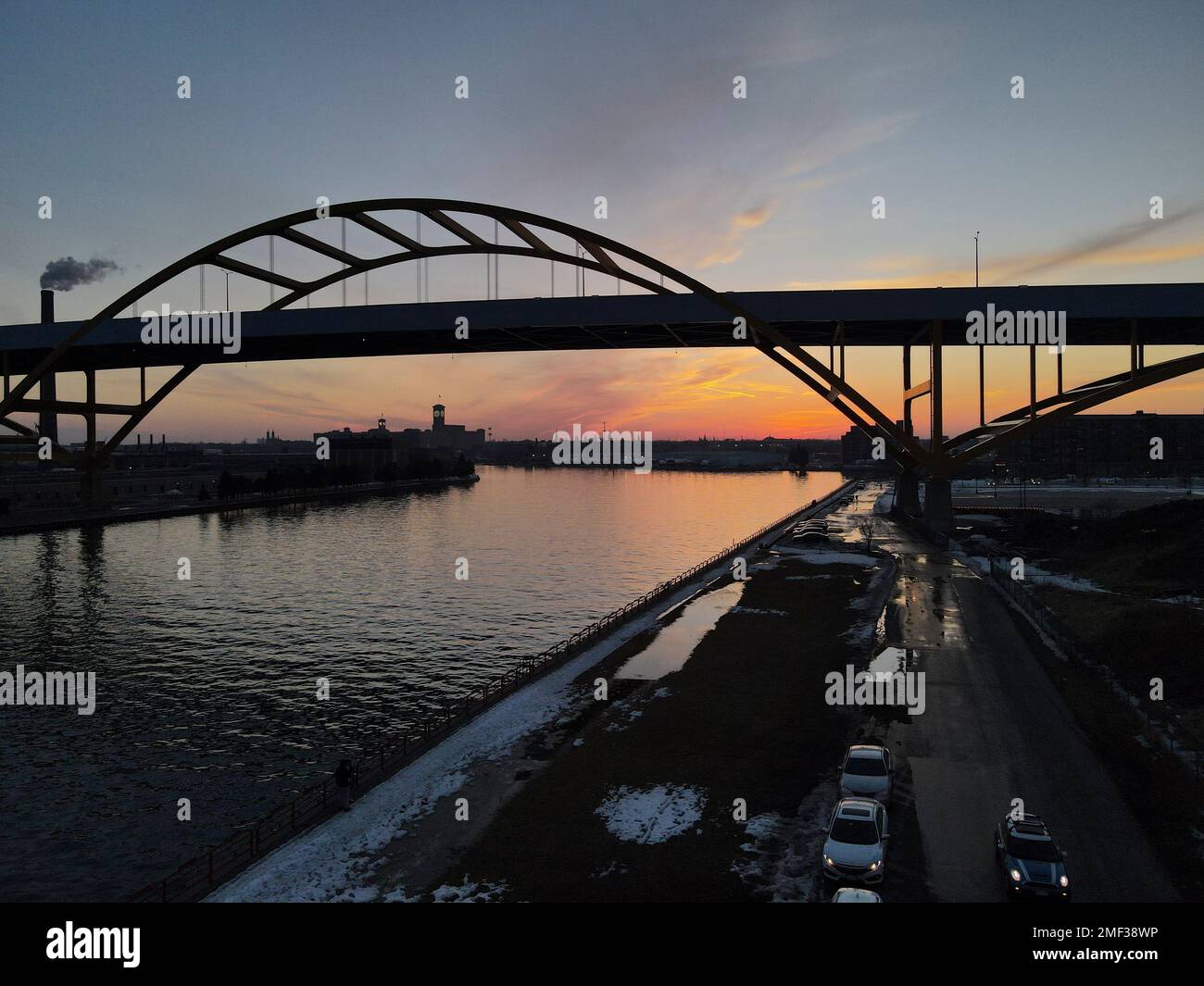 This image taken with a drone shows the Milwaukee Hoan Bridge at sunset ...