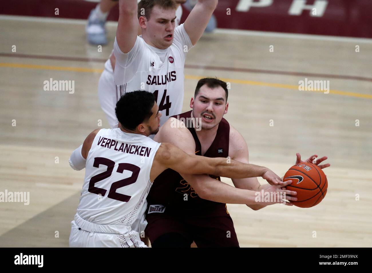 Loyola Chicago center Cameron Krutwig is pressured by Southern Illinois ...