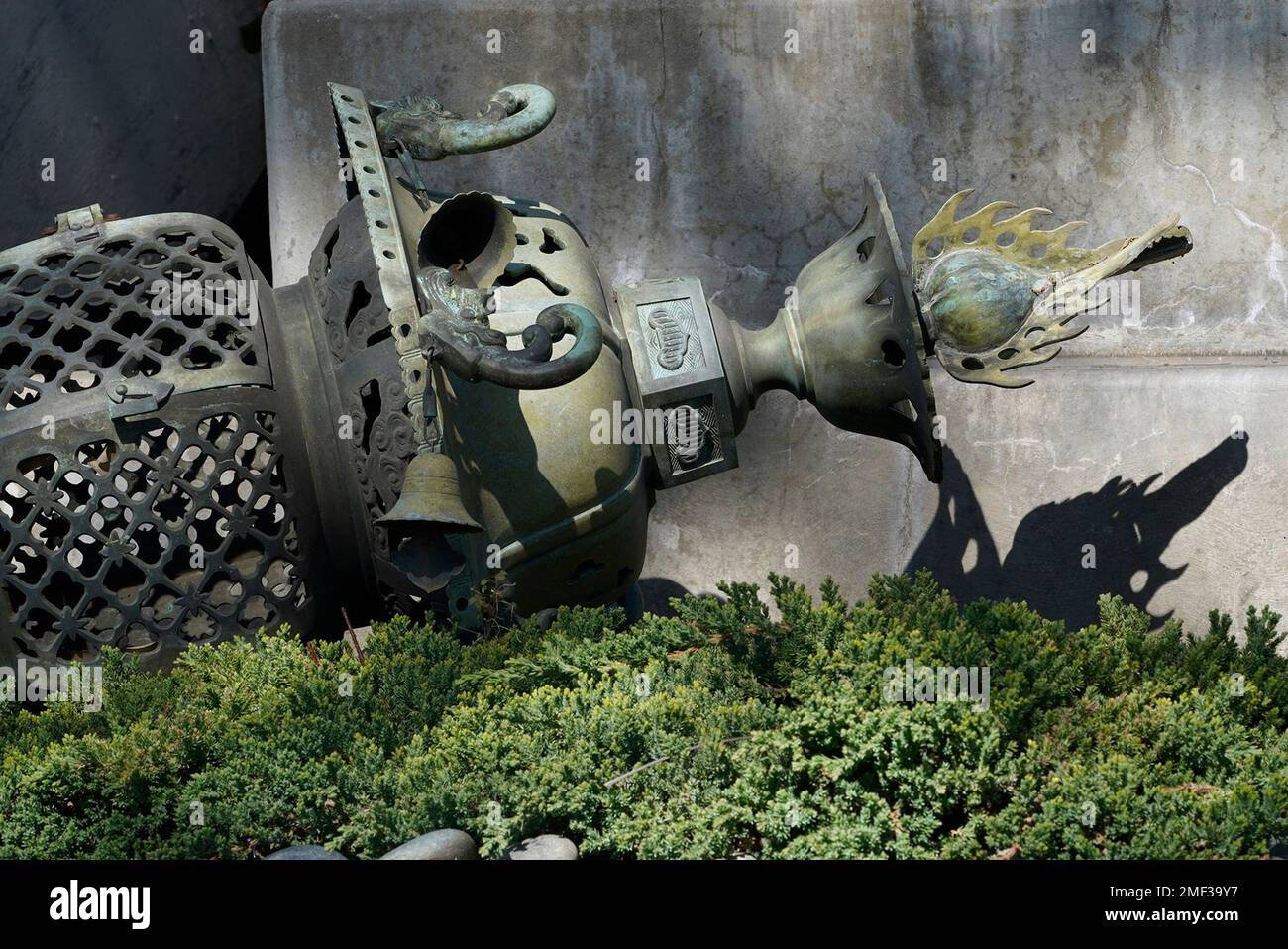One of a pair of metal lanterns knocked down at the entrance of the ...