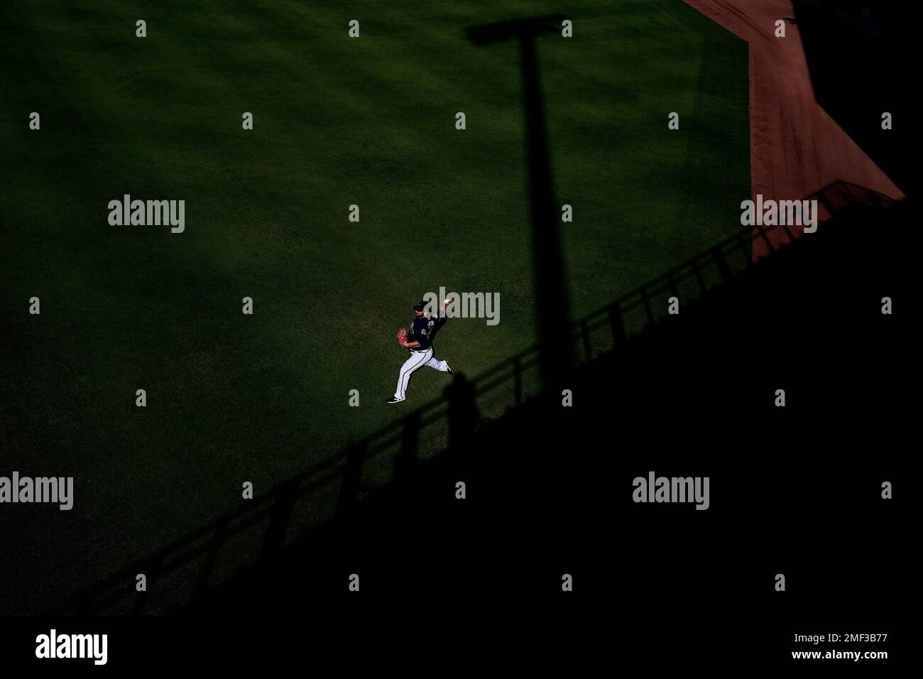 Atlanta Braves starting pitcher Bryse Wilson sets back to throw a ball ...