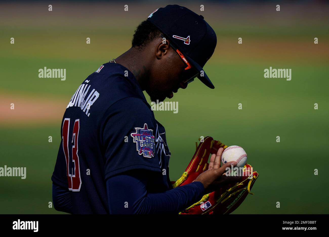 Atlanta Braves right fielder Ronald Acuna Jr. (13) looks at a baseball ...